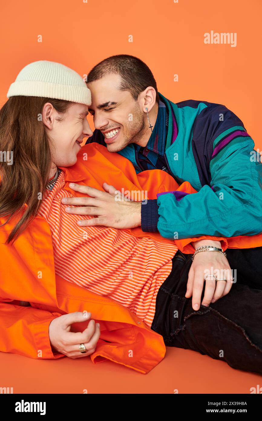 Two men laying on the ground hugging each other warmly Stock Photo - Alamy