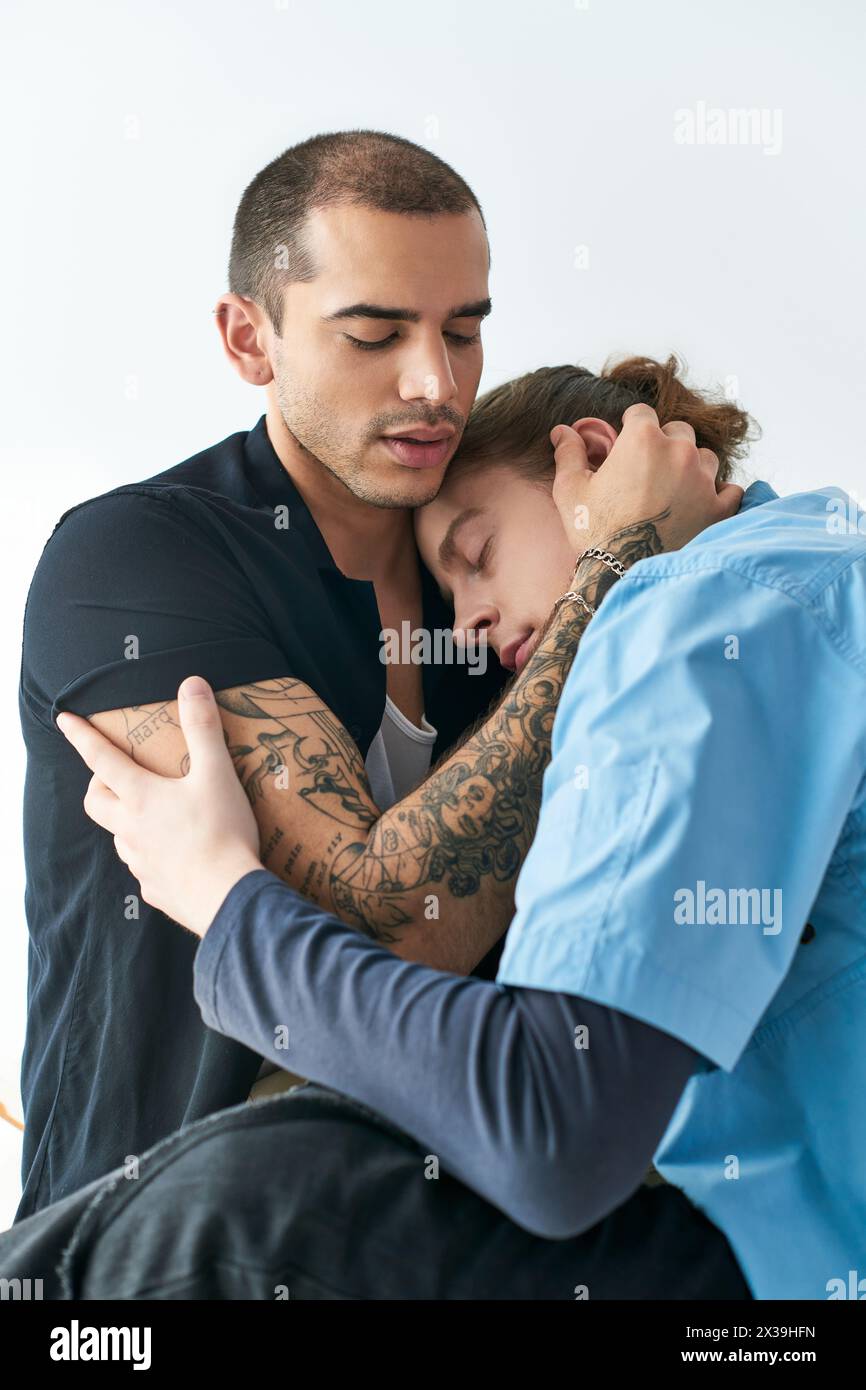 Two men wrapping each other in a warm hug Stock Photo - Alamy