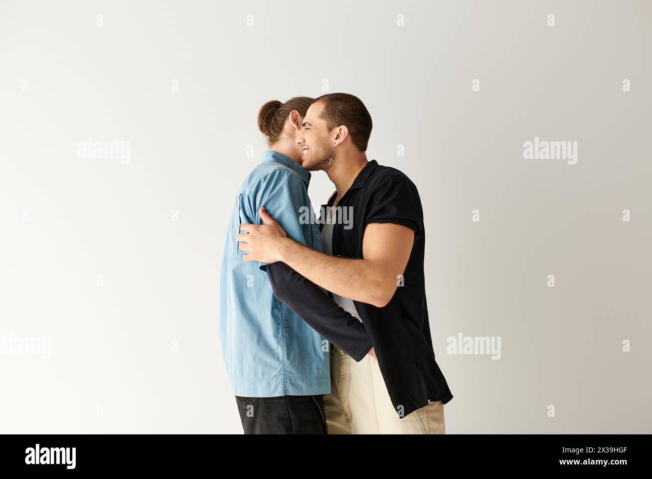 Two men standing side by side, exuding a sense of connection and ...