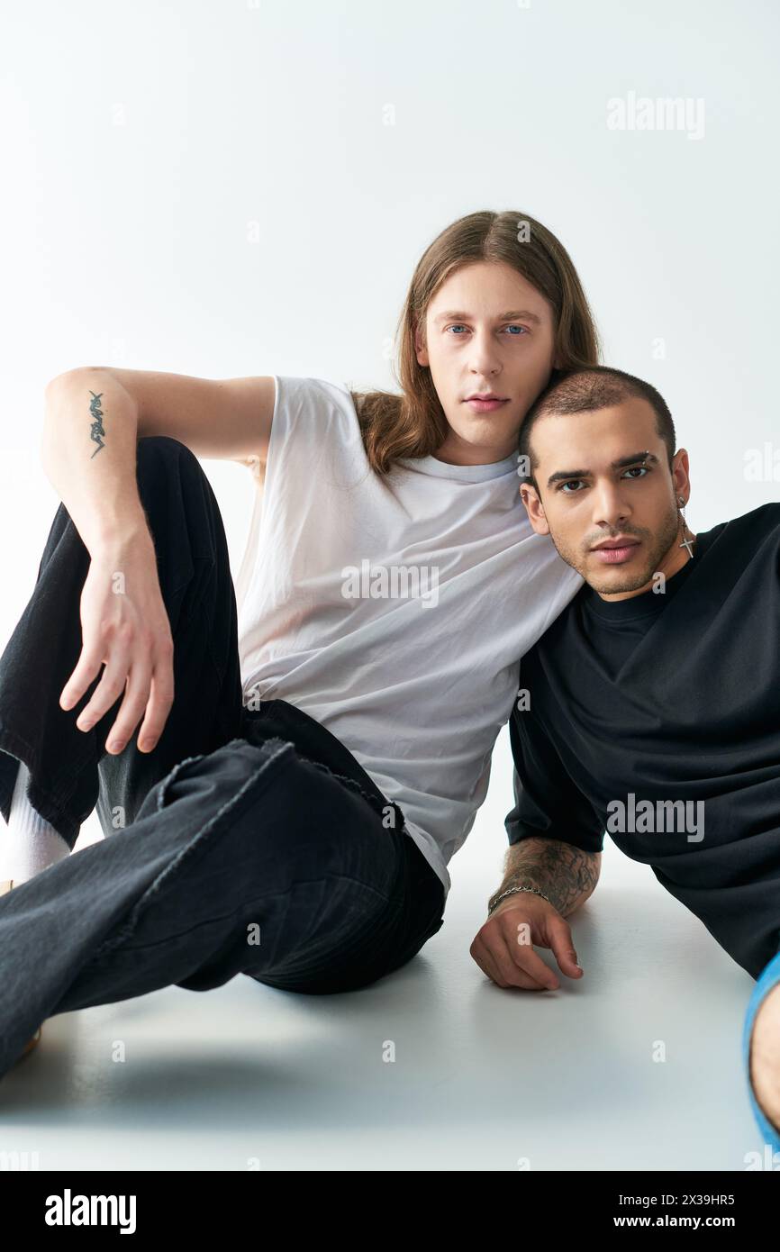 Two men peacefully sitting together Stock Photo - Alamy