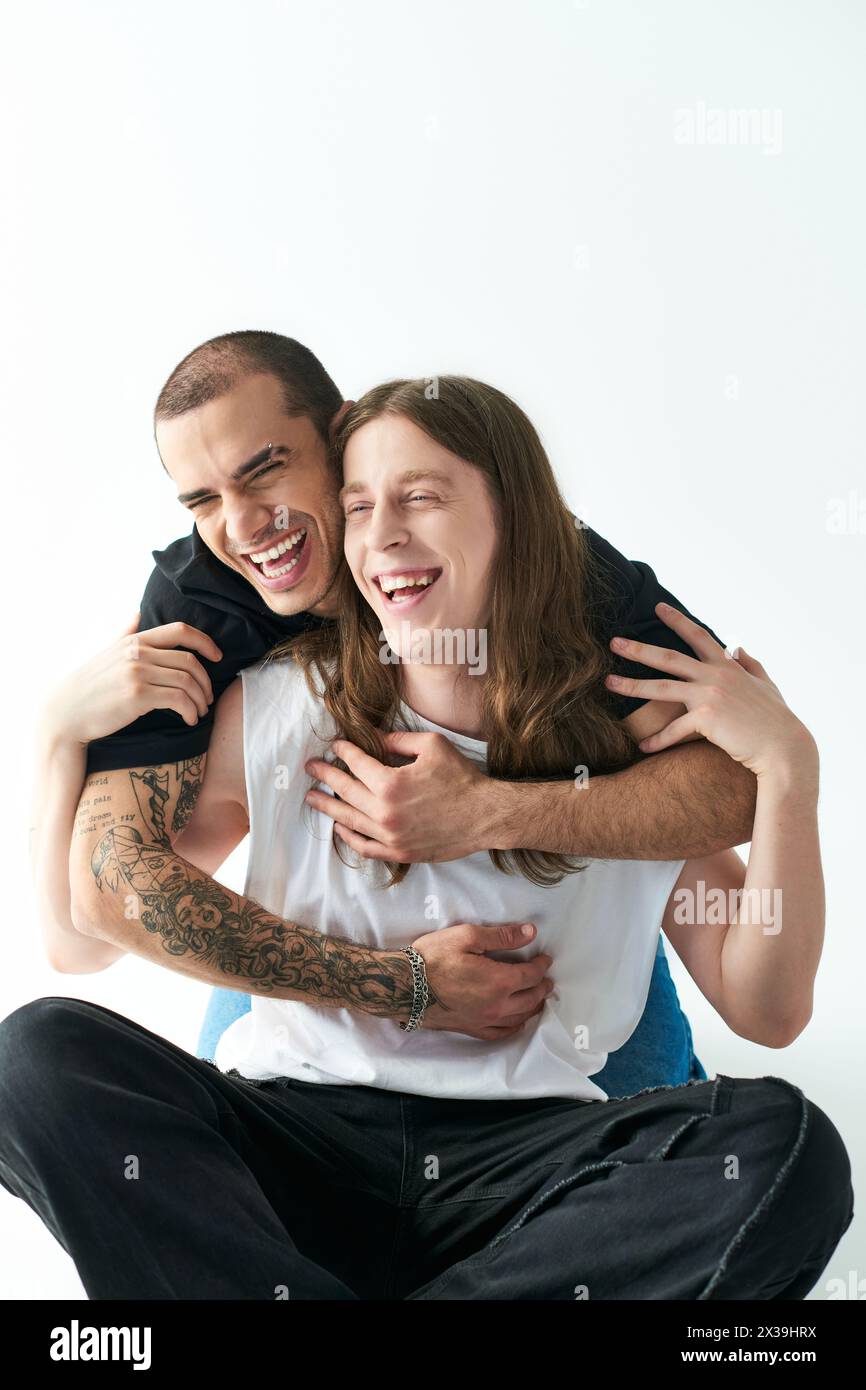 Two men tenderly hugging each other Stock Photo - Alamy