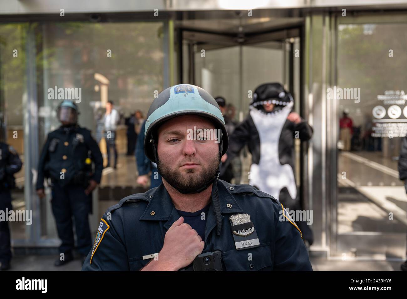 Environmental activists block the entrance to the headquarters of Citi ...