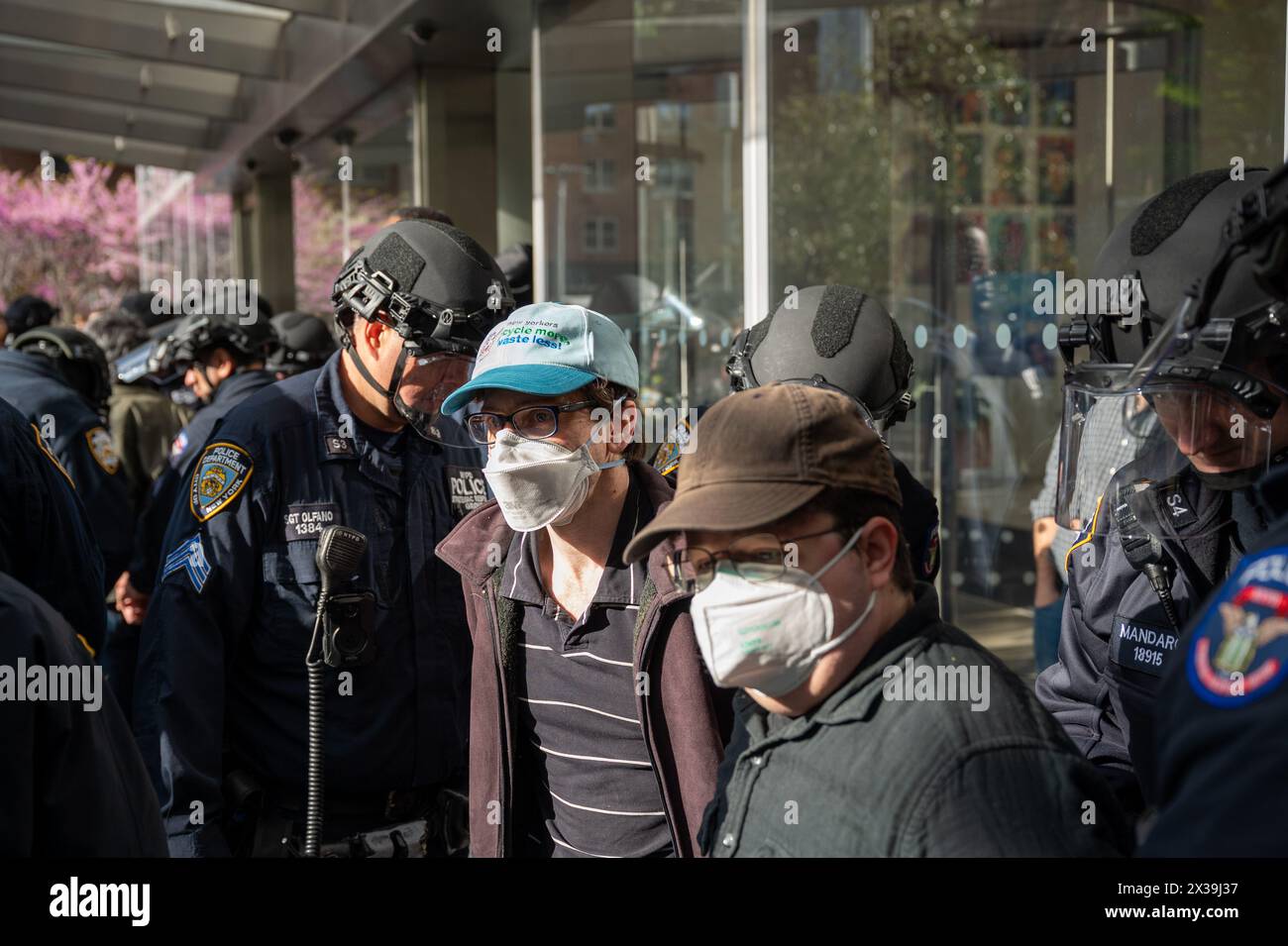 Environmental activists block the entrance to the headquarters of Citi ...