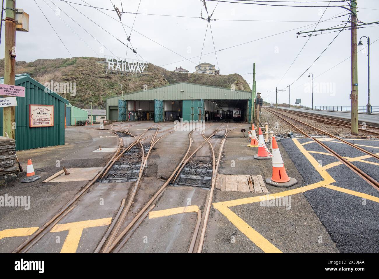 ELECTRIC RAILWAY sign of Manx Electric Railway high up on a rock face ...