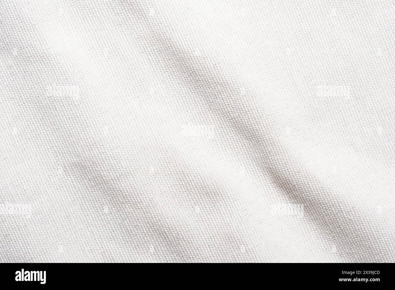 A soft, pure white fabric background with a delicate grid pattern. The ...