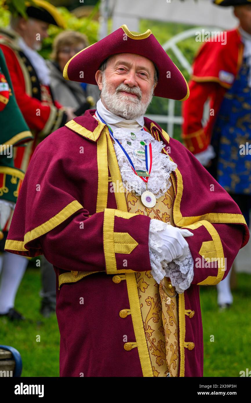 Town crier poses, standing looking at camera, giving smile (colourful ...