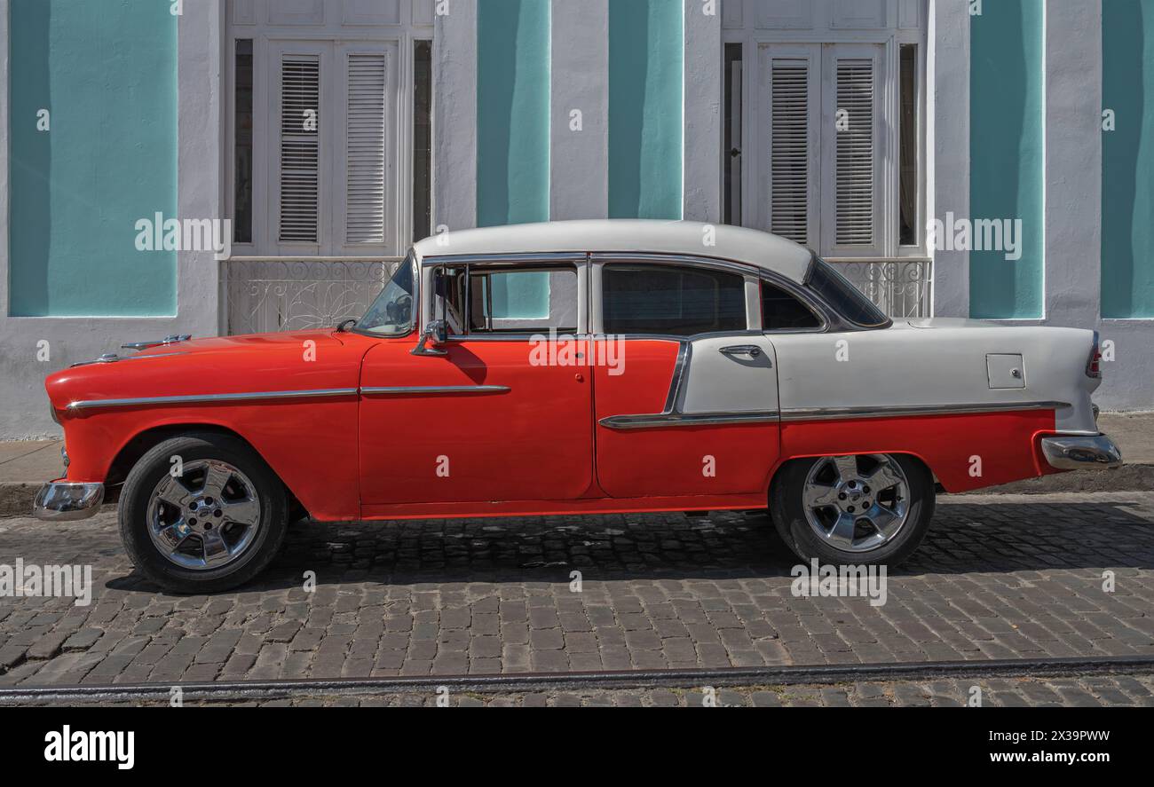 Restored classic American car parked on the roadside in front of ...