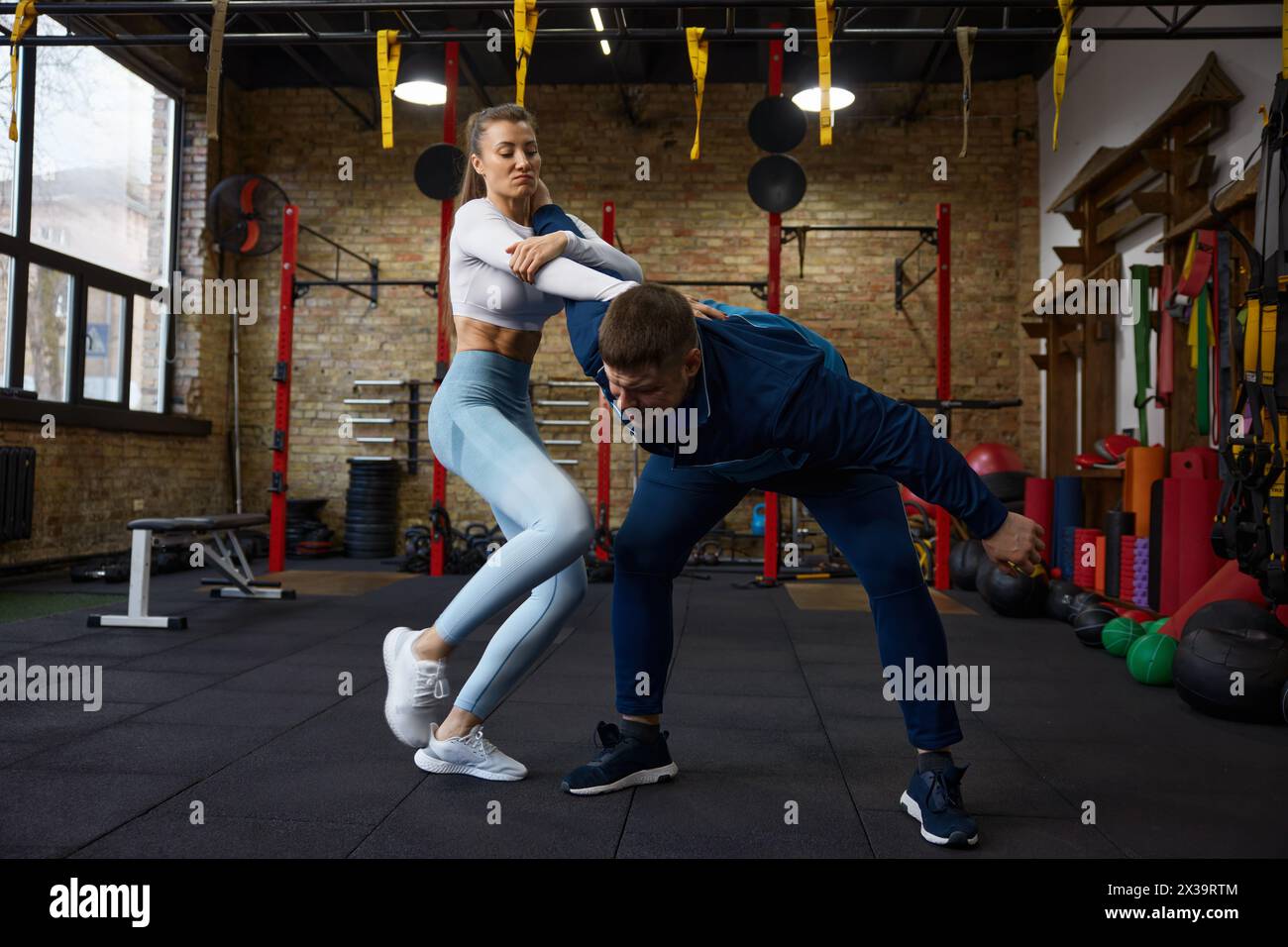 Woman grappling with man hi-res stock photography and images - Alamy