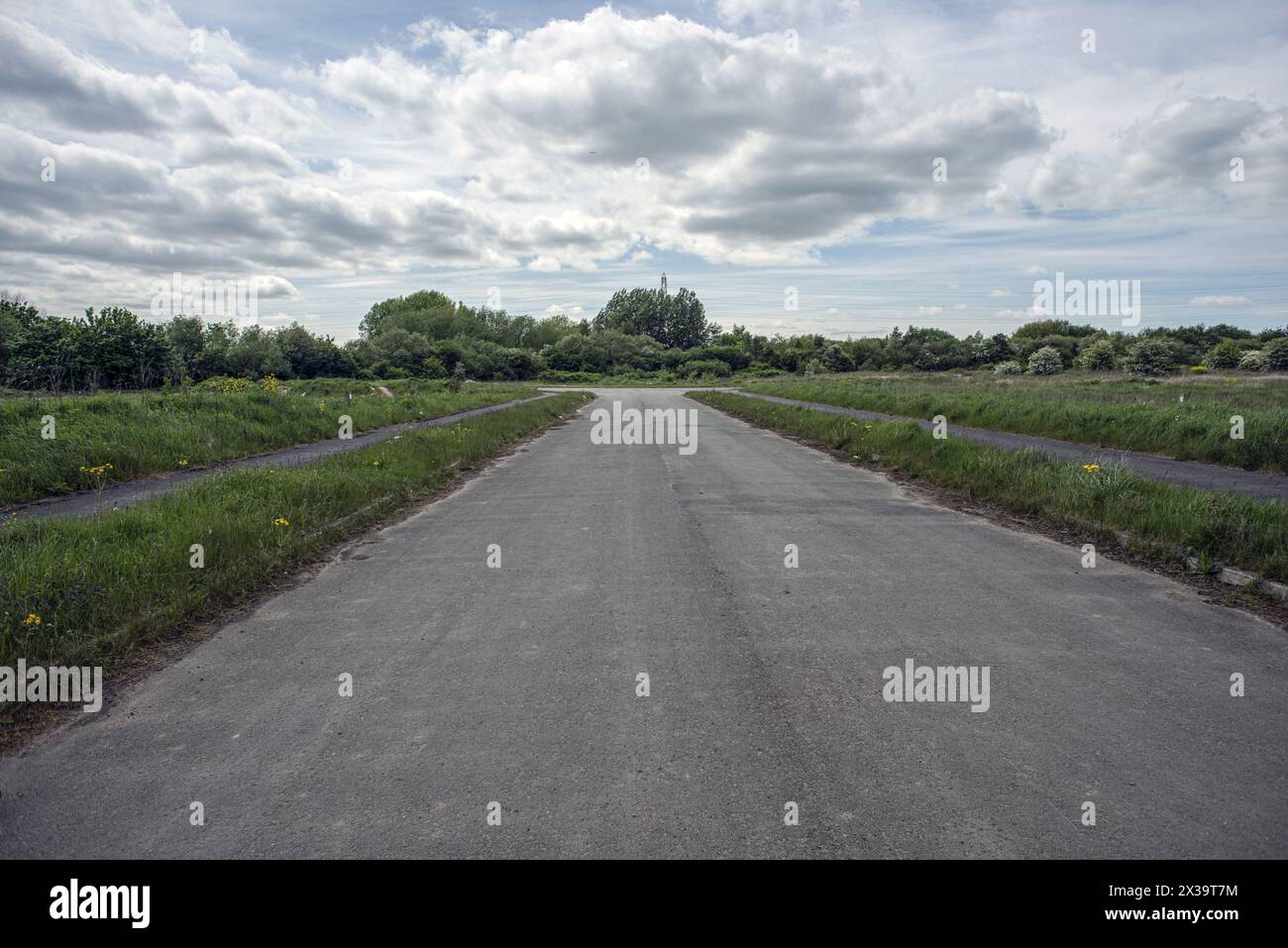 Brownfield land: former access road of industrial site Stock Photo - Alamy