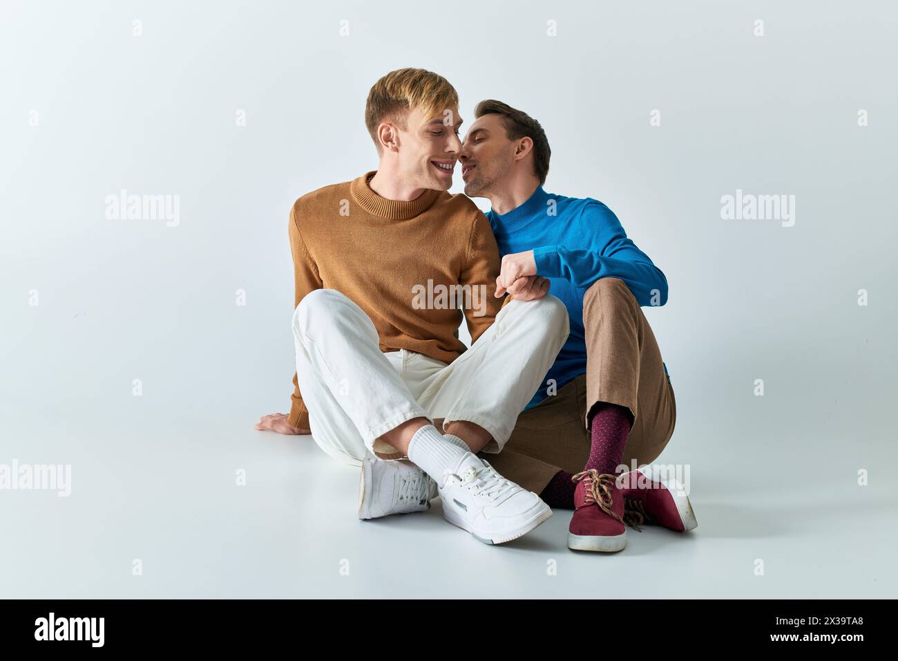 Two seated men support hi-res stock photography and images - Alamy