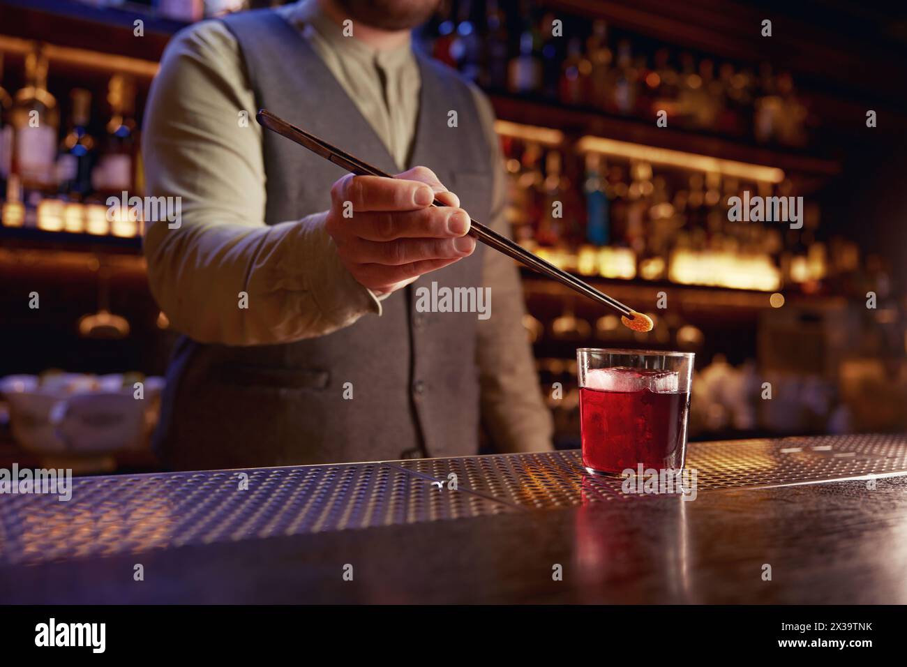Male bartender putting ice hi-res stock photography and images - Alamy