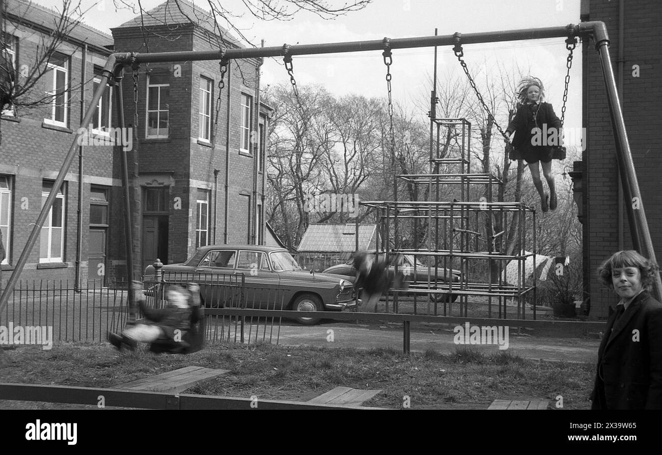 1960s, historical, three young schoolgirls outside in a school ...