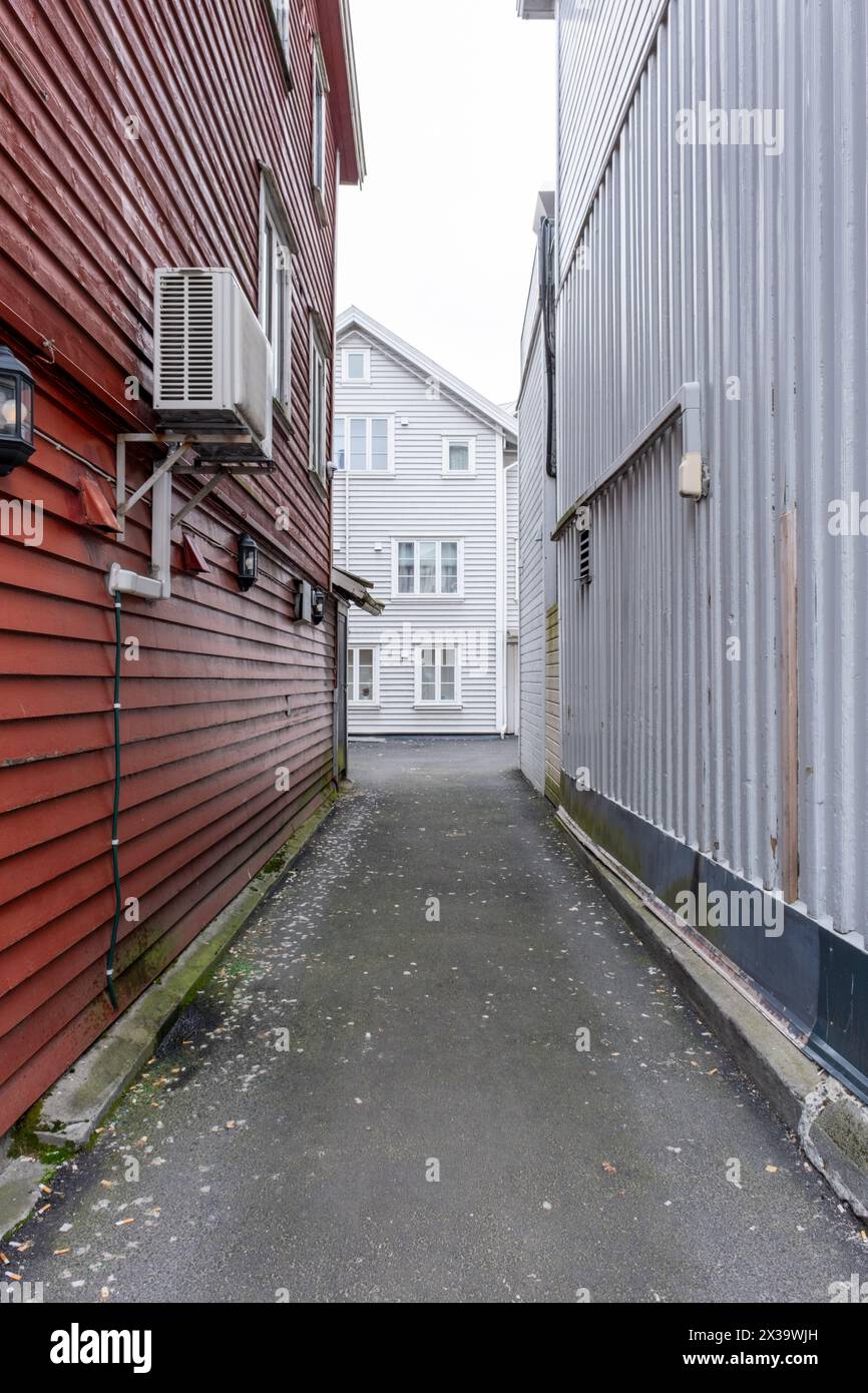 Narrow alleyway between two wood panel building in Haugesund, Norway ...