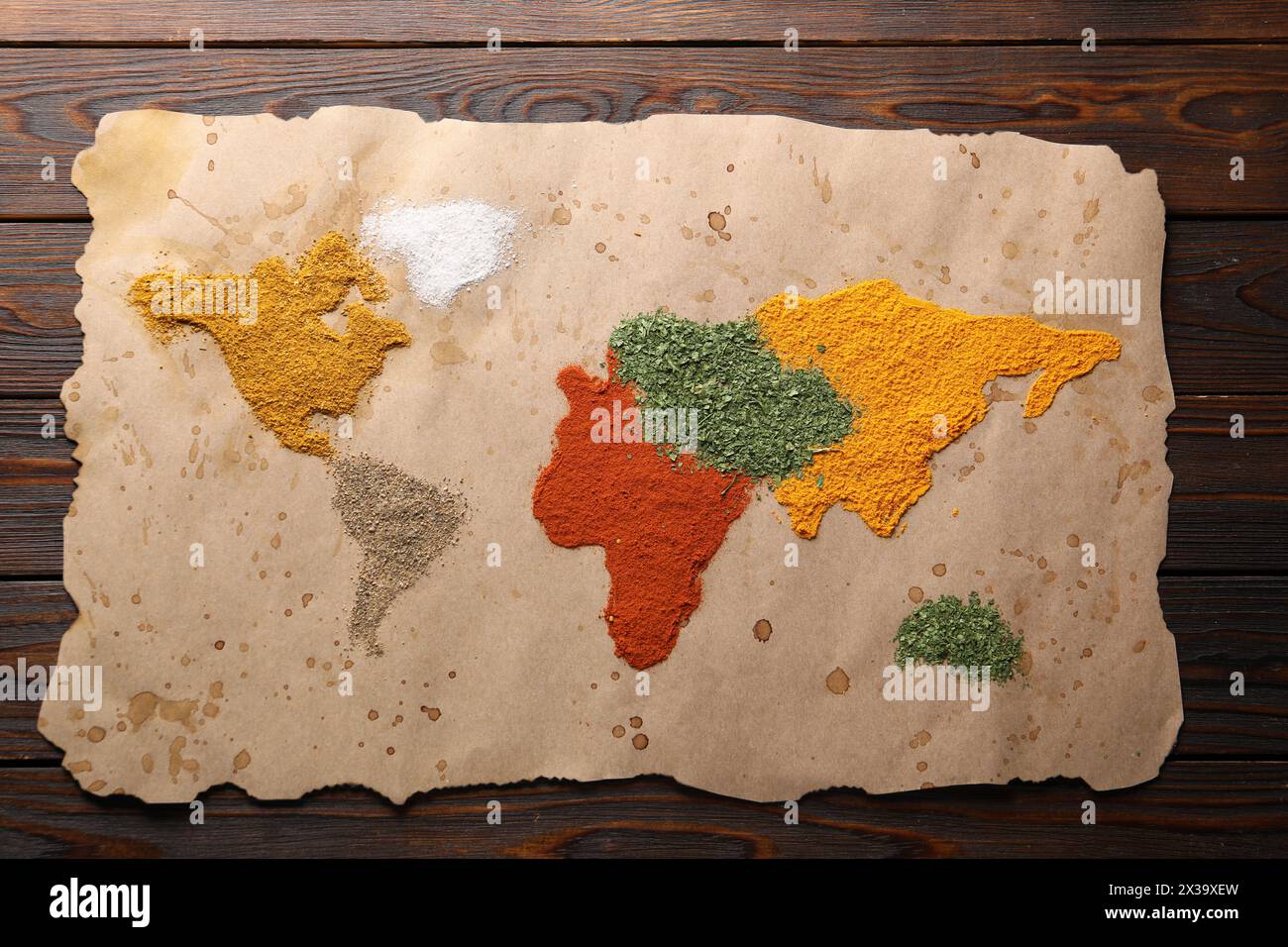 World map of different spices on wooden table, top view Stock Photo - Alamy