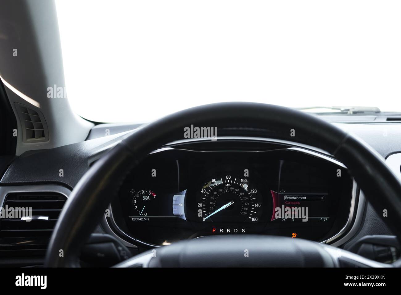 Speedometer on dashboard and steering wheel inside car Stock Photo - Alamy