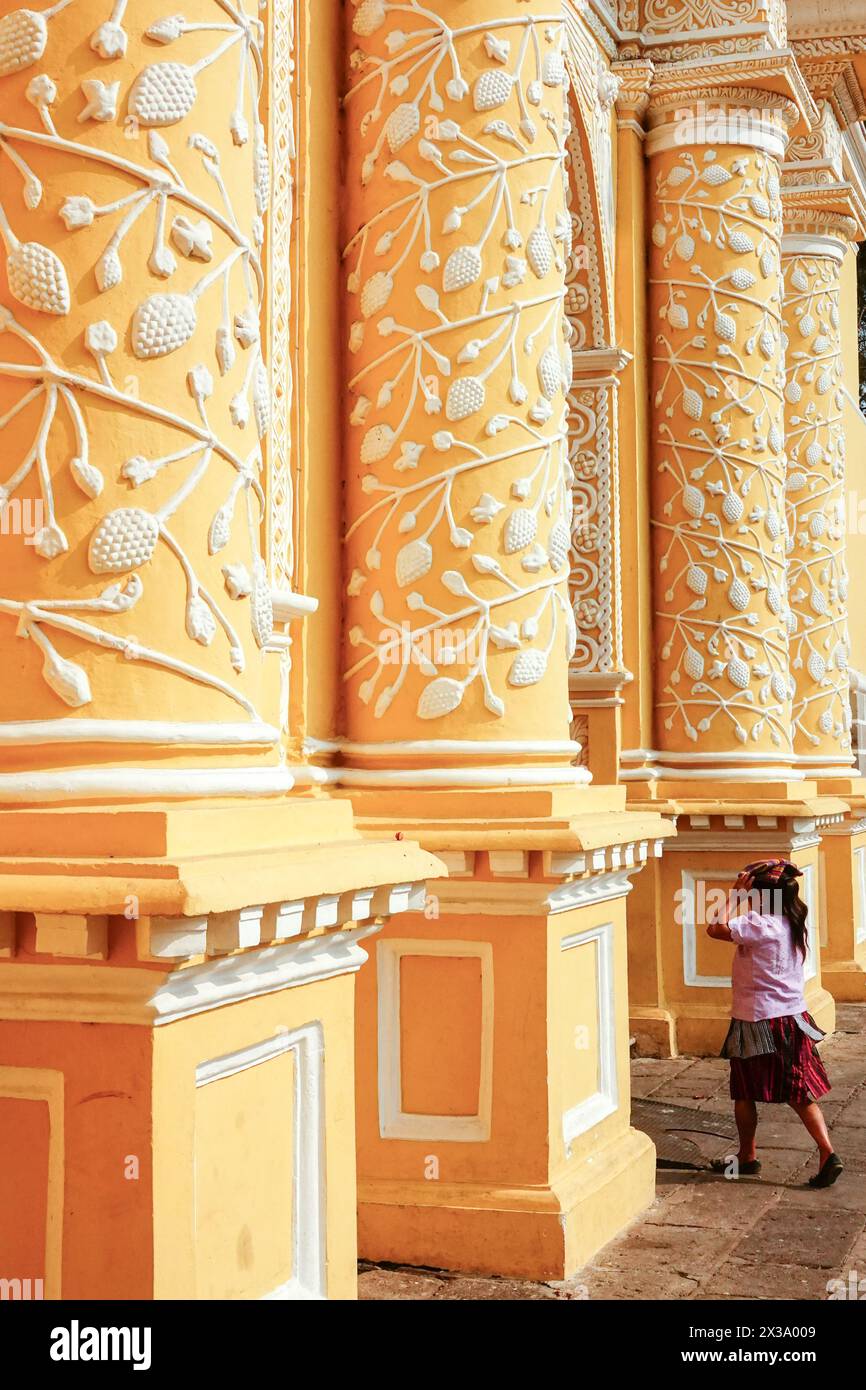 An indigenous Mayan woman walks into the Church and Convent of La ...