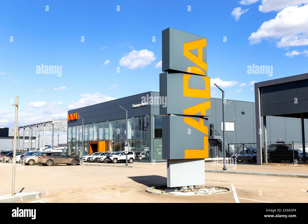 Samara, Russia - April 16, 2024: Dealership sign Lada next the office ...