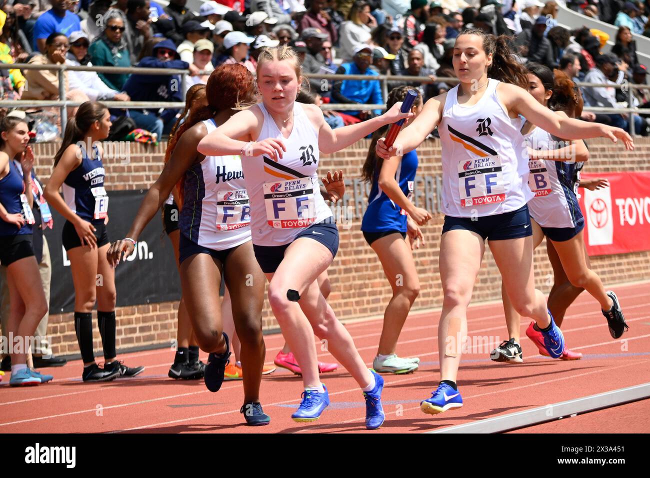 Athletes compete in the running of the first day of the 128th Penn ...