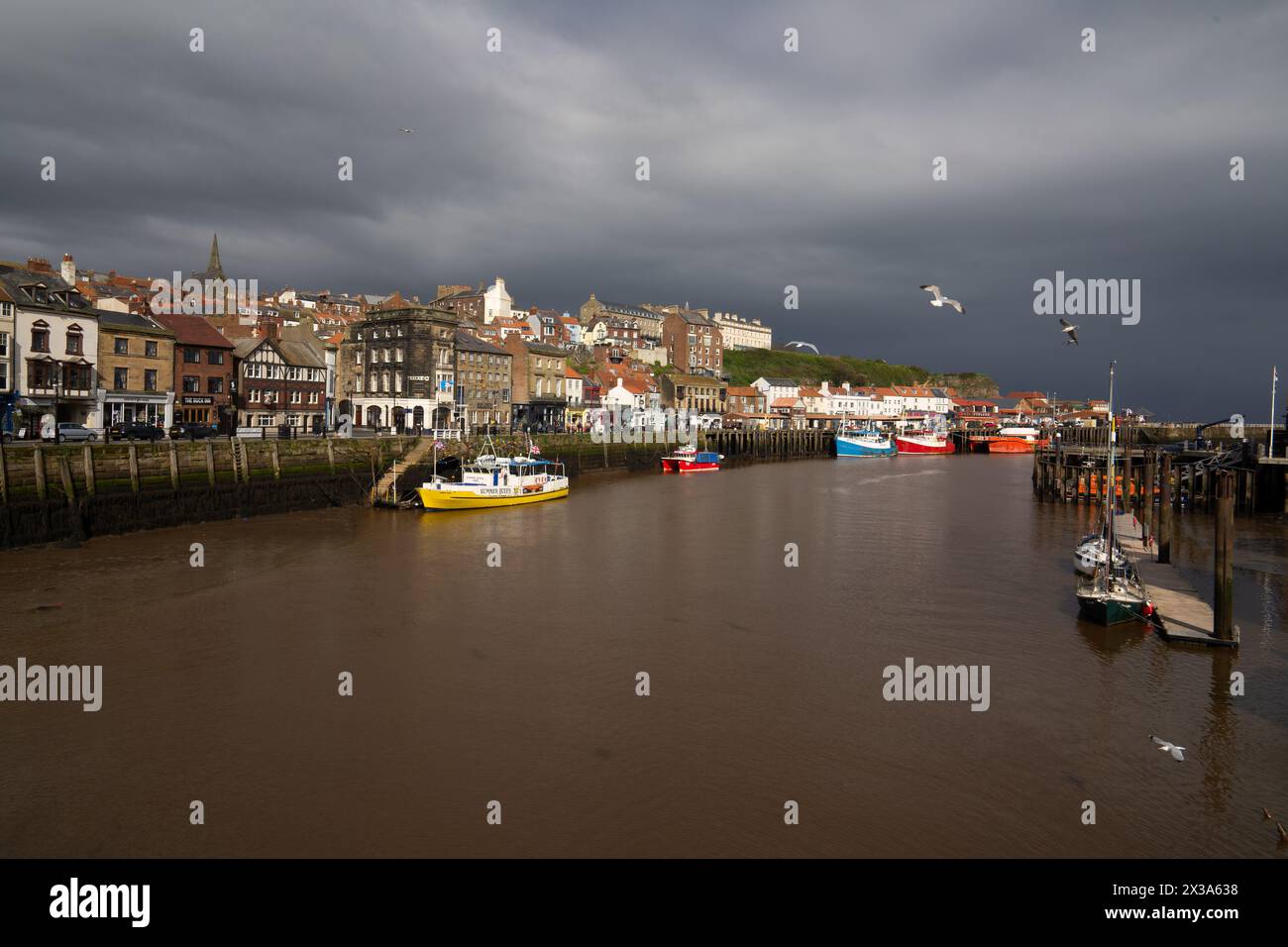 Pleasure boats in the harbour of the east coast resort of Whitby, North ...