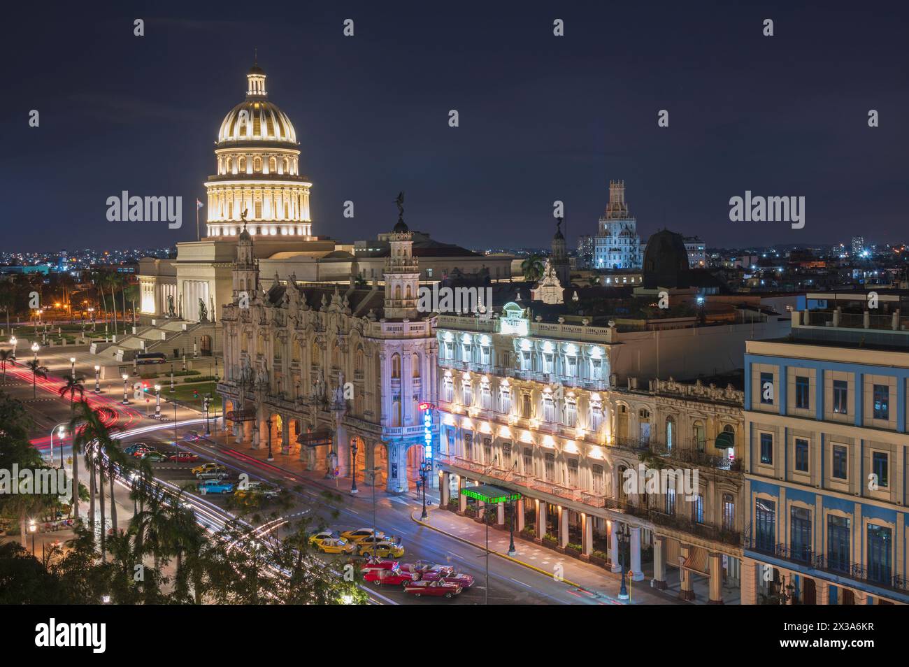 A night time view across Central park, Havana, Cuba, showing the mix of ...