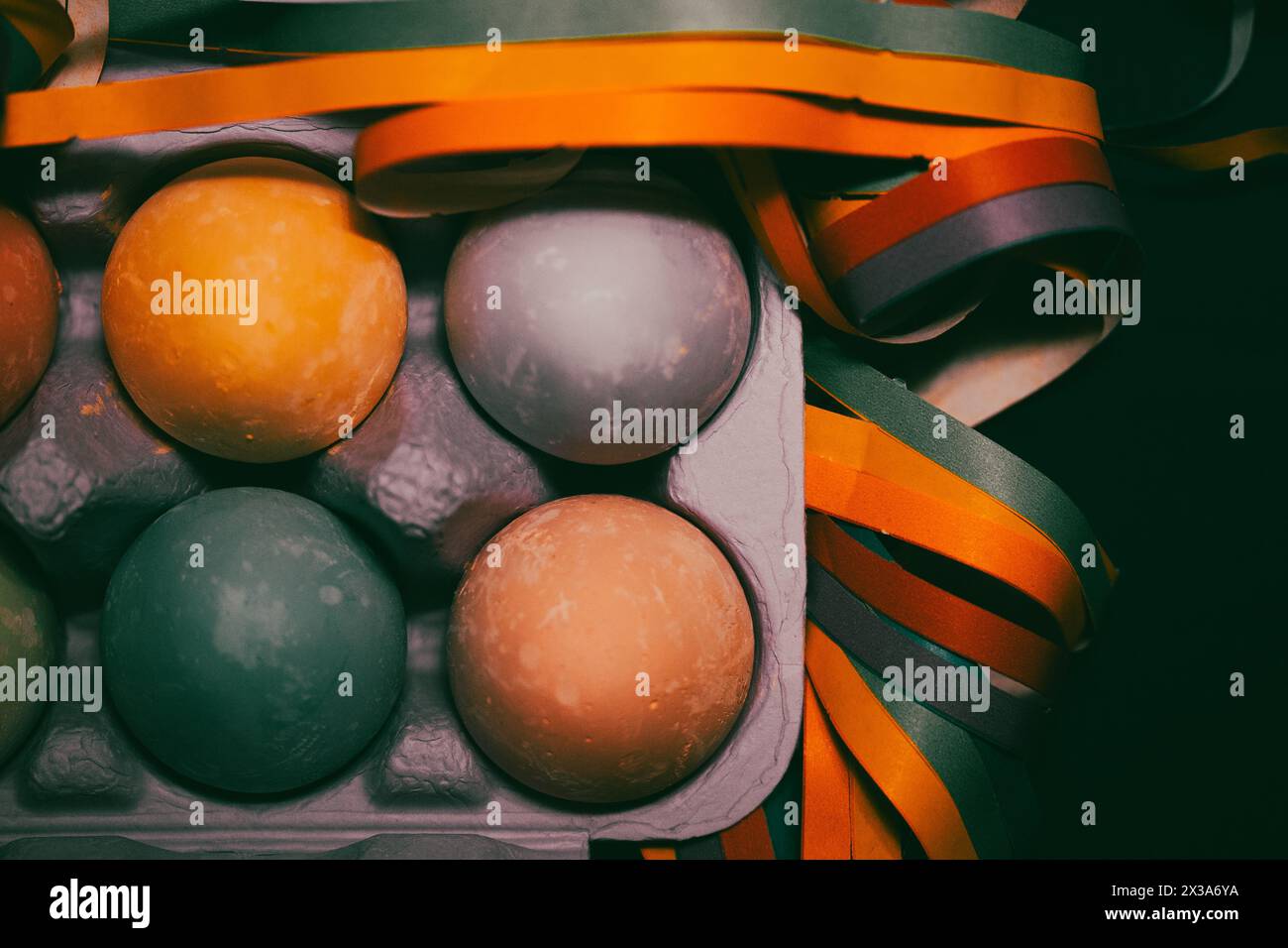 Collection of beautifully painted Easter eggs nestled in a violet box ...