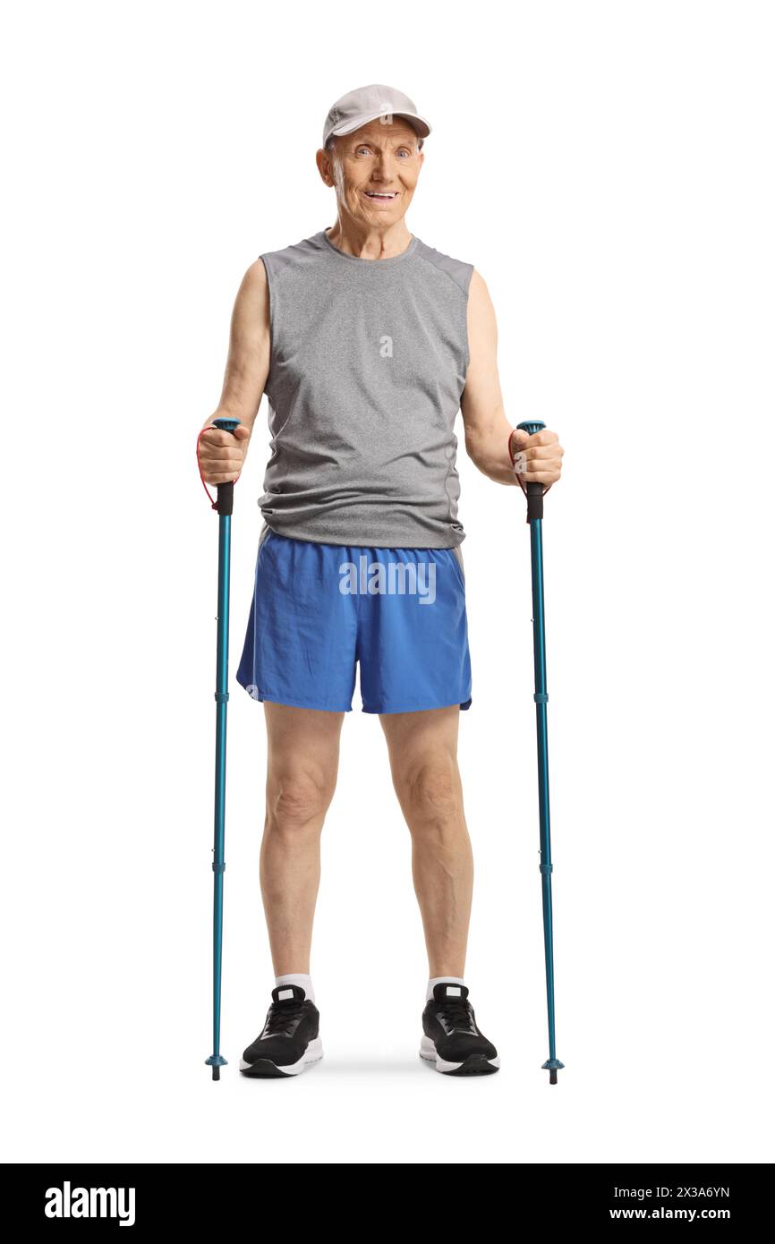 Elderly man standing with walking poles isolated on white background ...