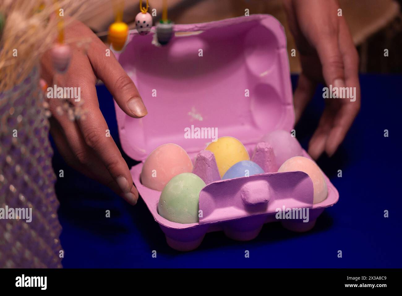 Collection of beautifully painted Easter eggs nestled in a violet box ...