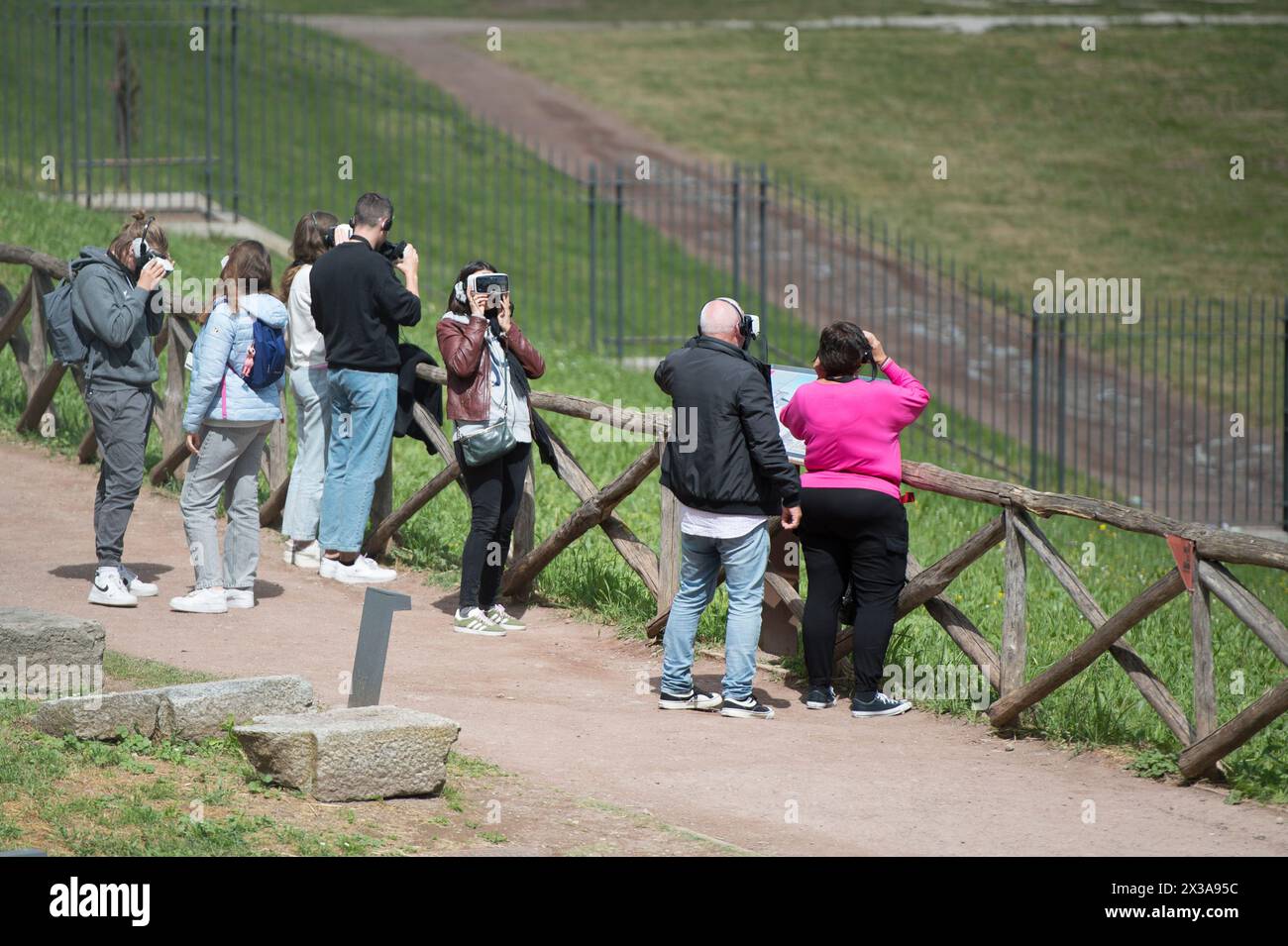 Rome, Italy. 25th Apr, 2024. Tourists with augmented reality viewers ...