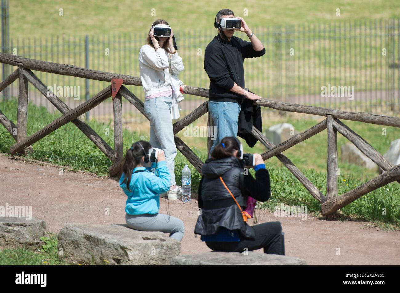 Rome, Italy. 25th Apr, 2024. Tourists with augmented reality viewers ...