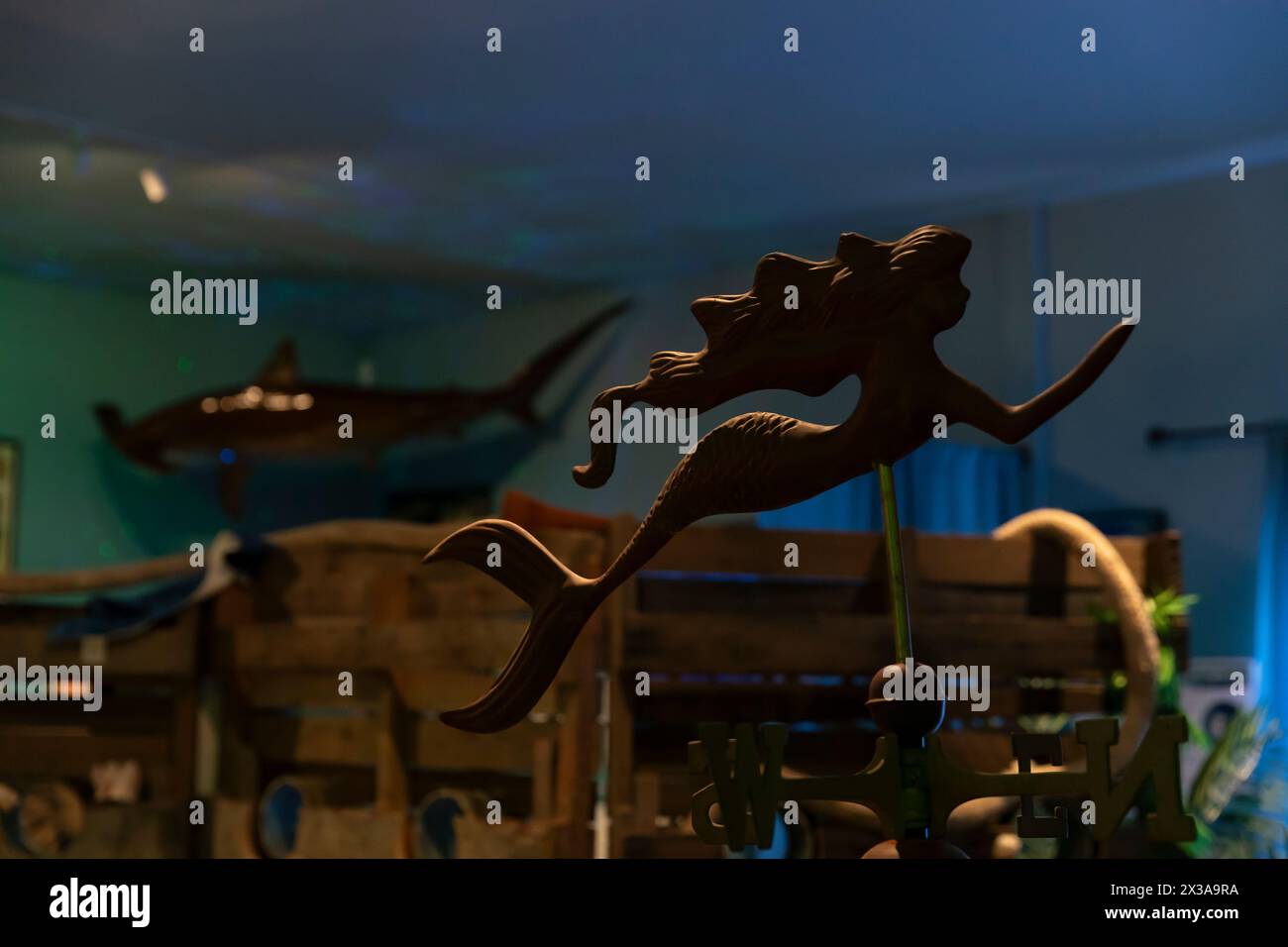 A mermaid weathervane is displayed among fantastical exhibits at the ...