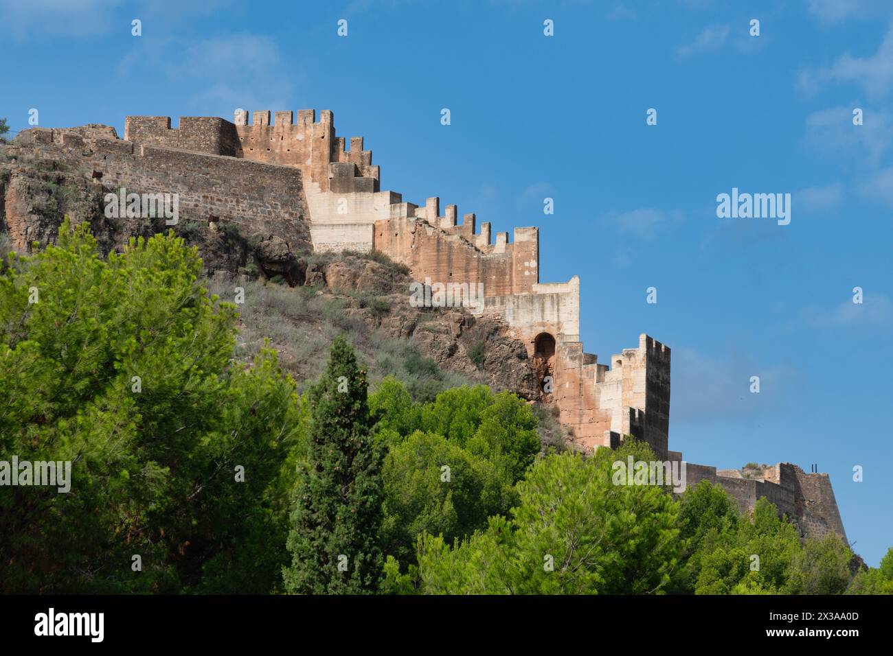 View of the castle in Sagunt, showcasing thick walls, a large gate ...
