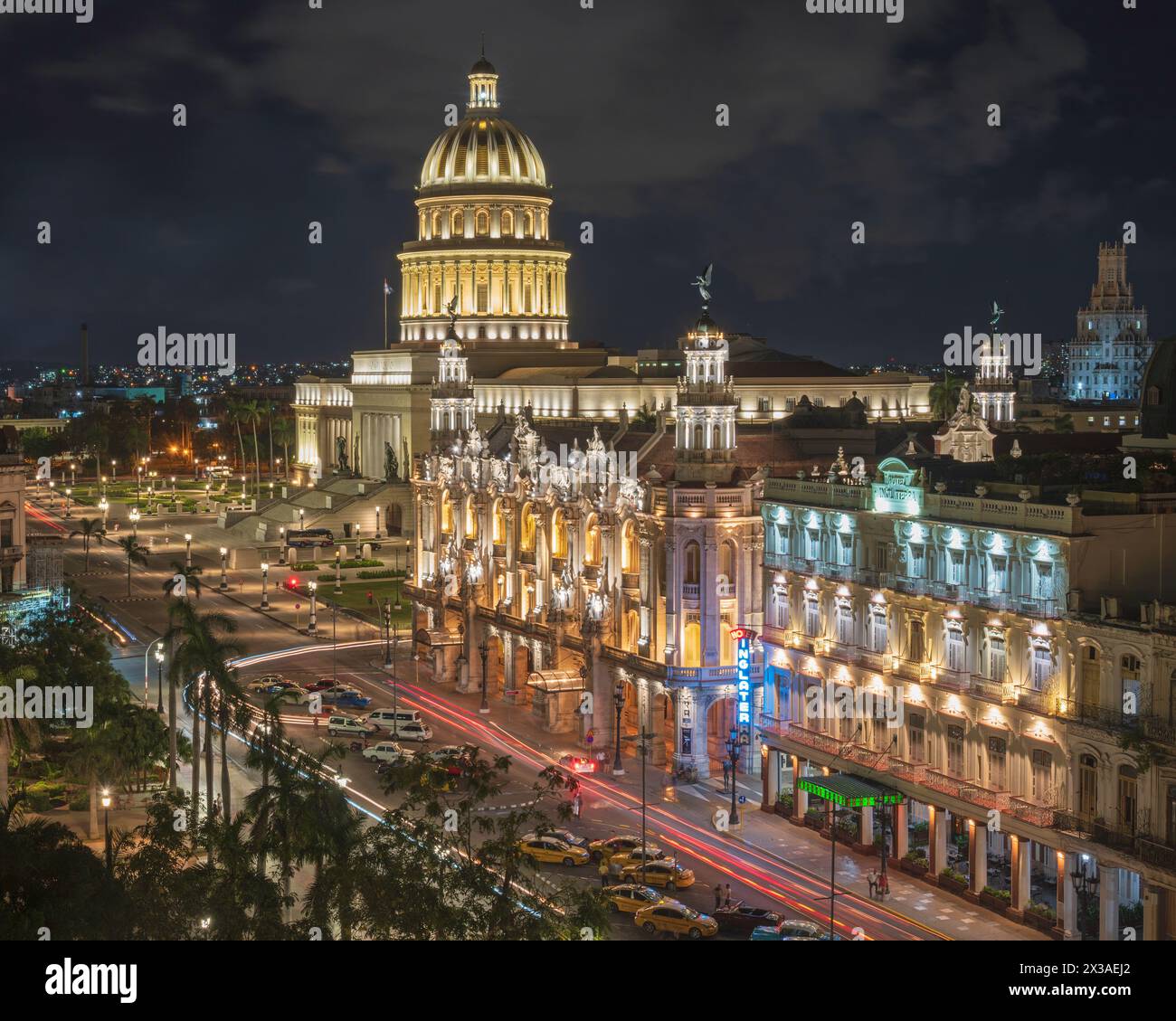 A night time view across Central park, Havana, Cuba, showing the mix of ...