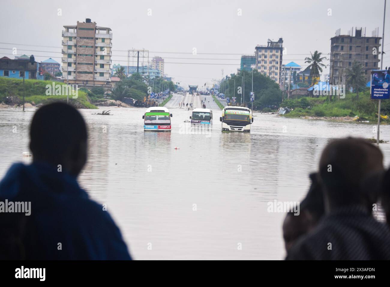 Dar Es Salaam, Tanzania. 25th Apr, 2024. People look at buses in ...
