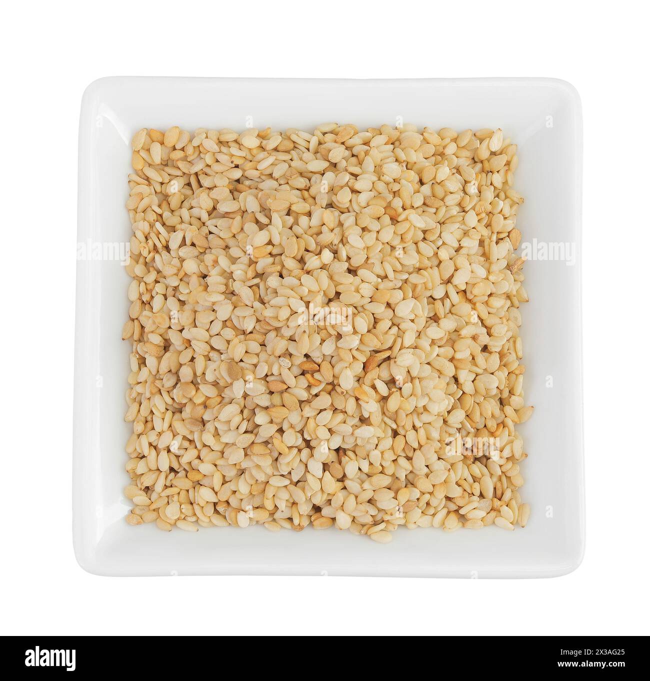 Sesame seeds in ceramic bowl isolated on white background. Top view ...