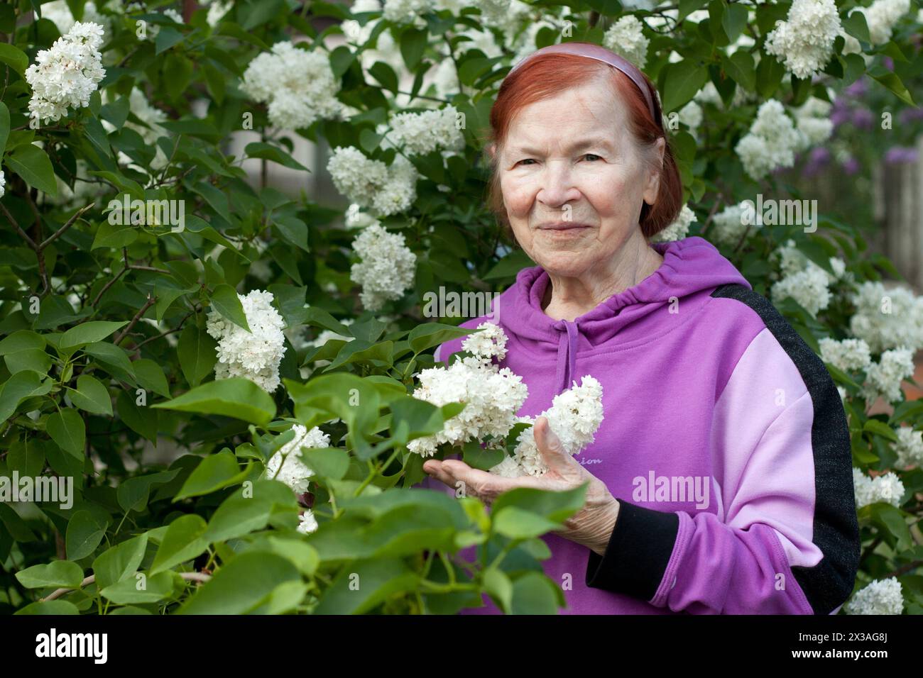 Outdoor close-up portrait of old senior woman. Beautiful elderly woman ...