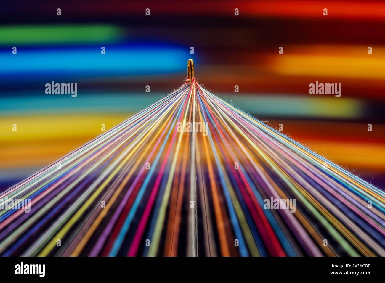 Converging Multi-colored Sewing Thread with motion blur effect on a ...