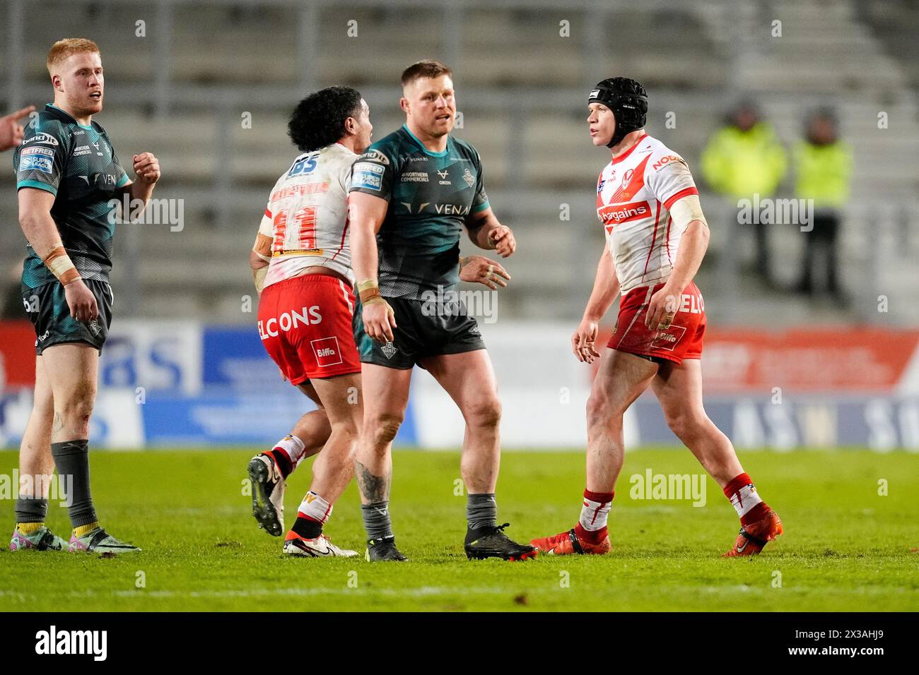 St Helens' Jonny Lomax (right) celebrates after scoring their side's ...