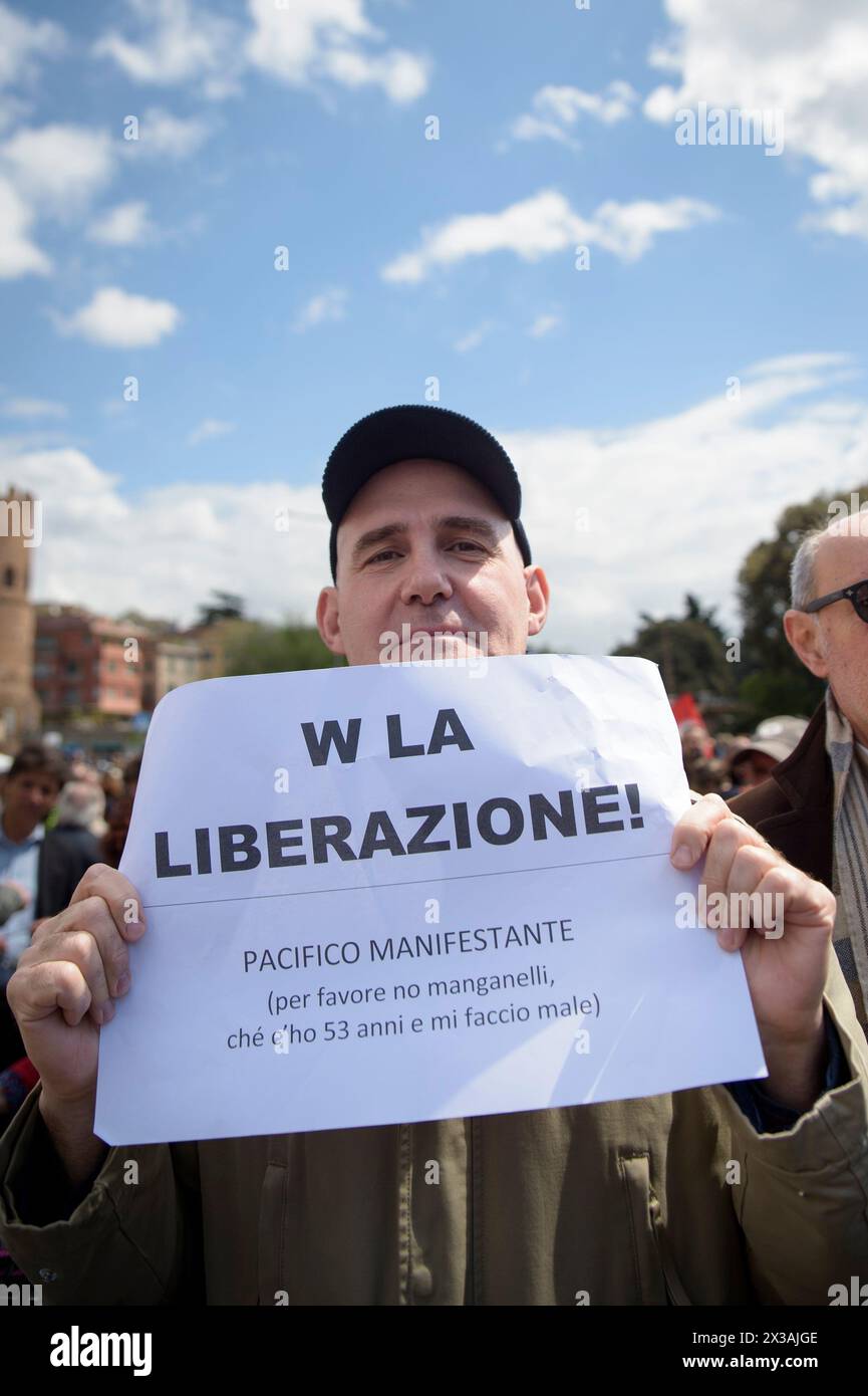 Rome, Italy. 25th Apr, 2024. A man shows a sheet of paper with the ...