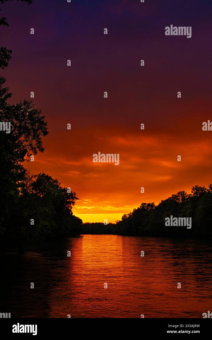 Amazing Sunset. Burning sky and flaming river between forests Stock ...