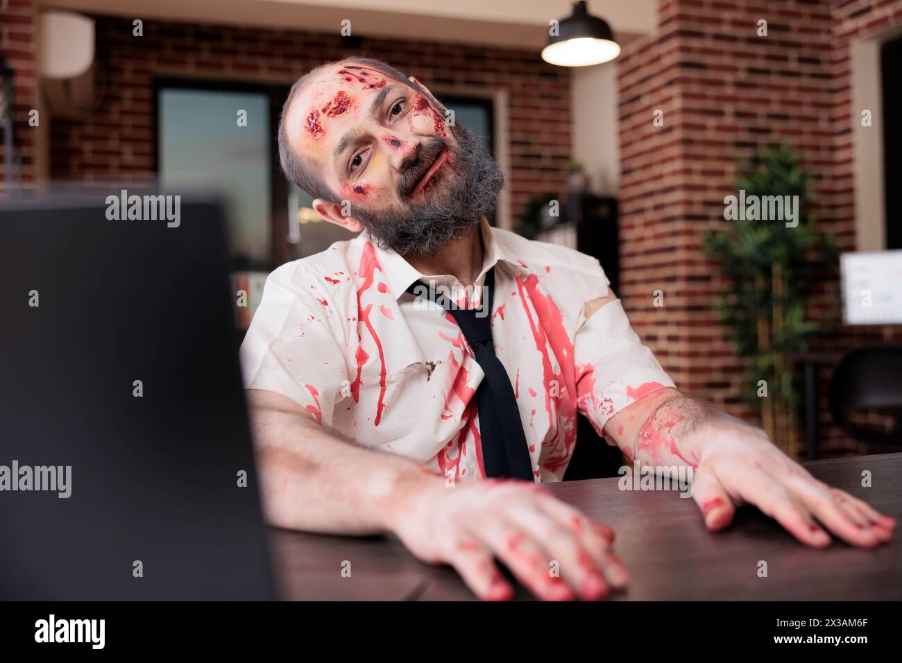 Portrait of overworked man with drowsy expression, limping on office ...