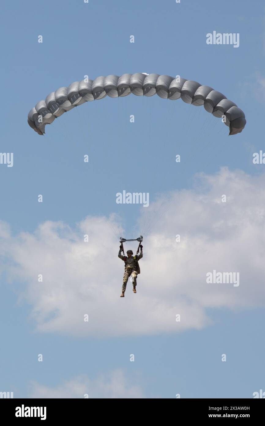 A U.S. Army Soldier conducts a free fall airborne jump out of a C-130 ...