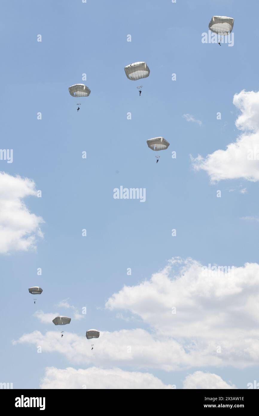 U.S. Army Soldiers conduct static line airborne jumps out of a C-130 ...