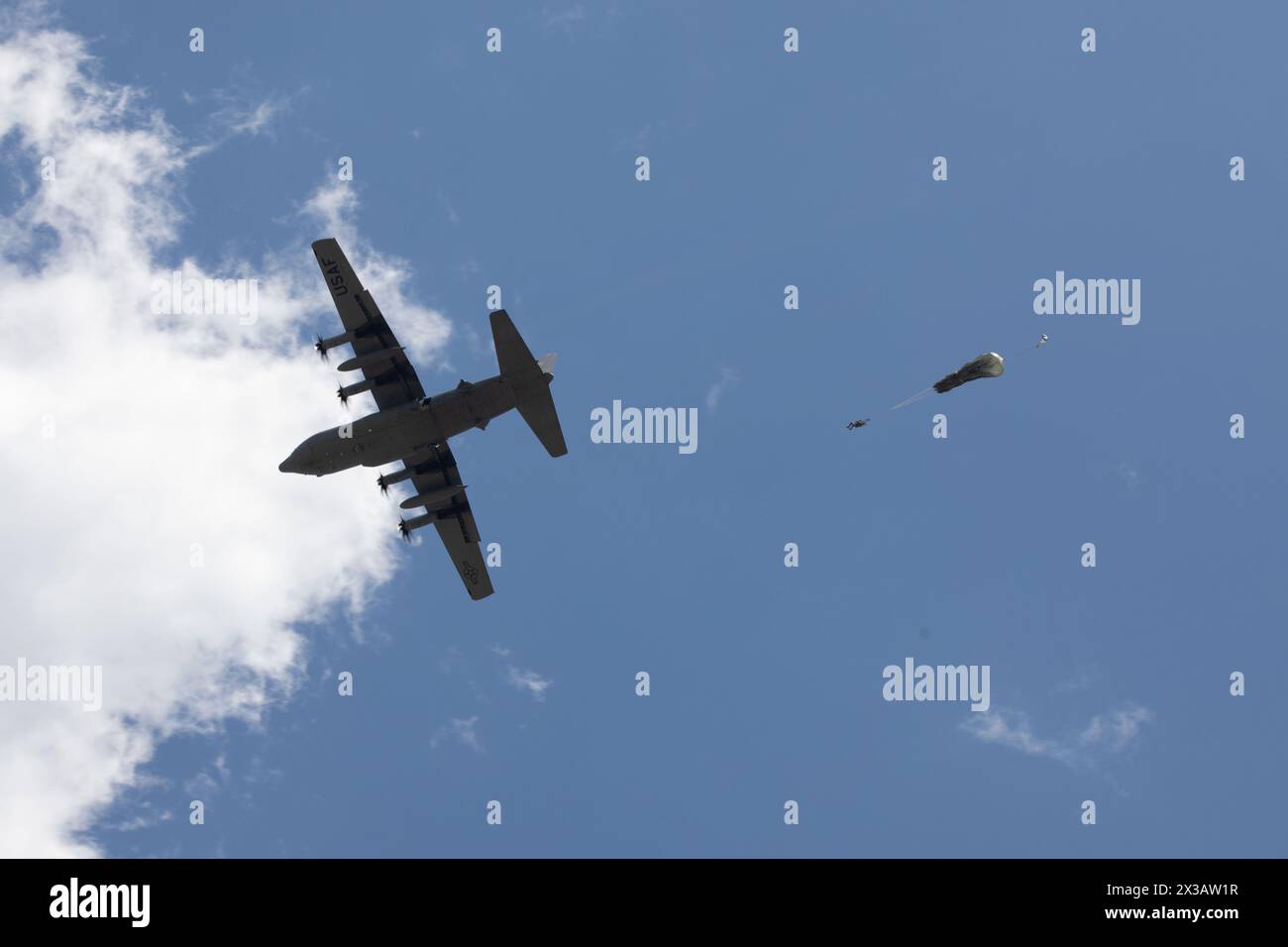 A U.S. Army Soldier conducts a static line airborne jump out of a C-130 ...