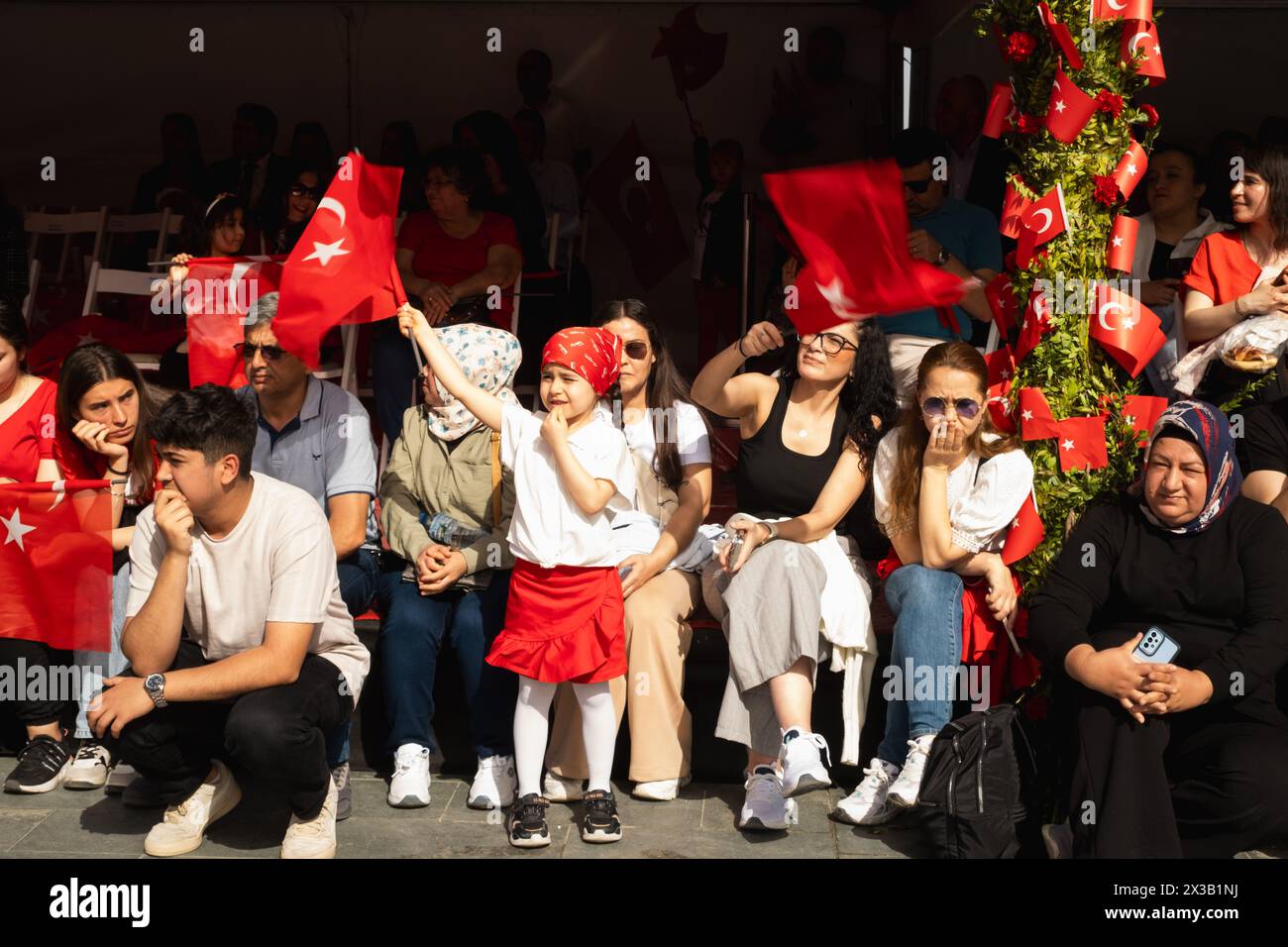 Izmir, Turkey - April 23, 2024: Onlookers with Turkish flags seated ...