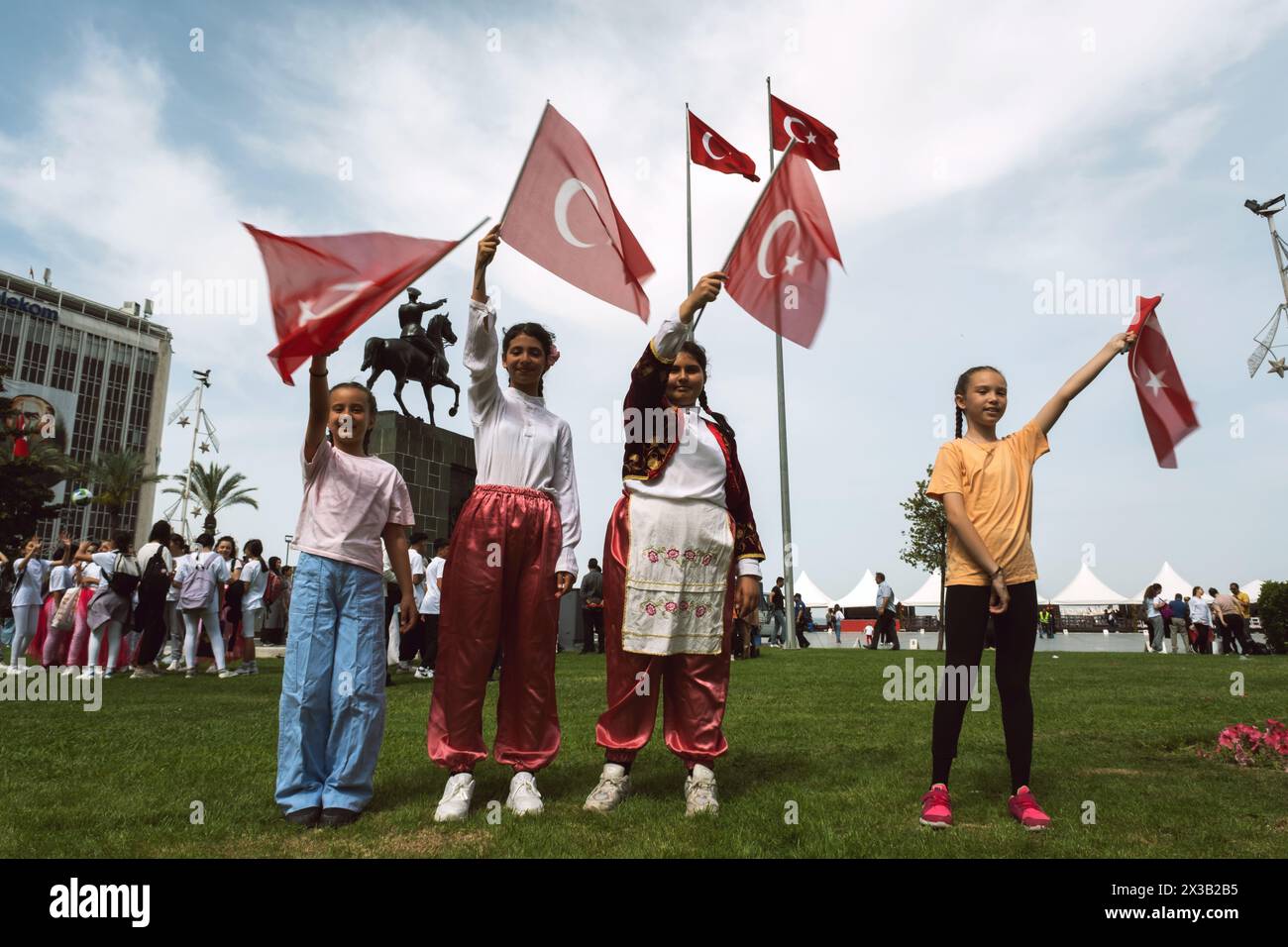 Izmir, Turkey - April 23, 2024: Four joyful girls waves the Turkish ...