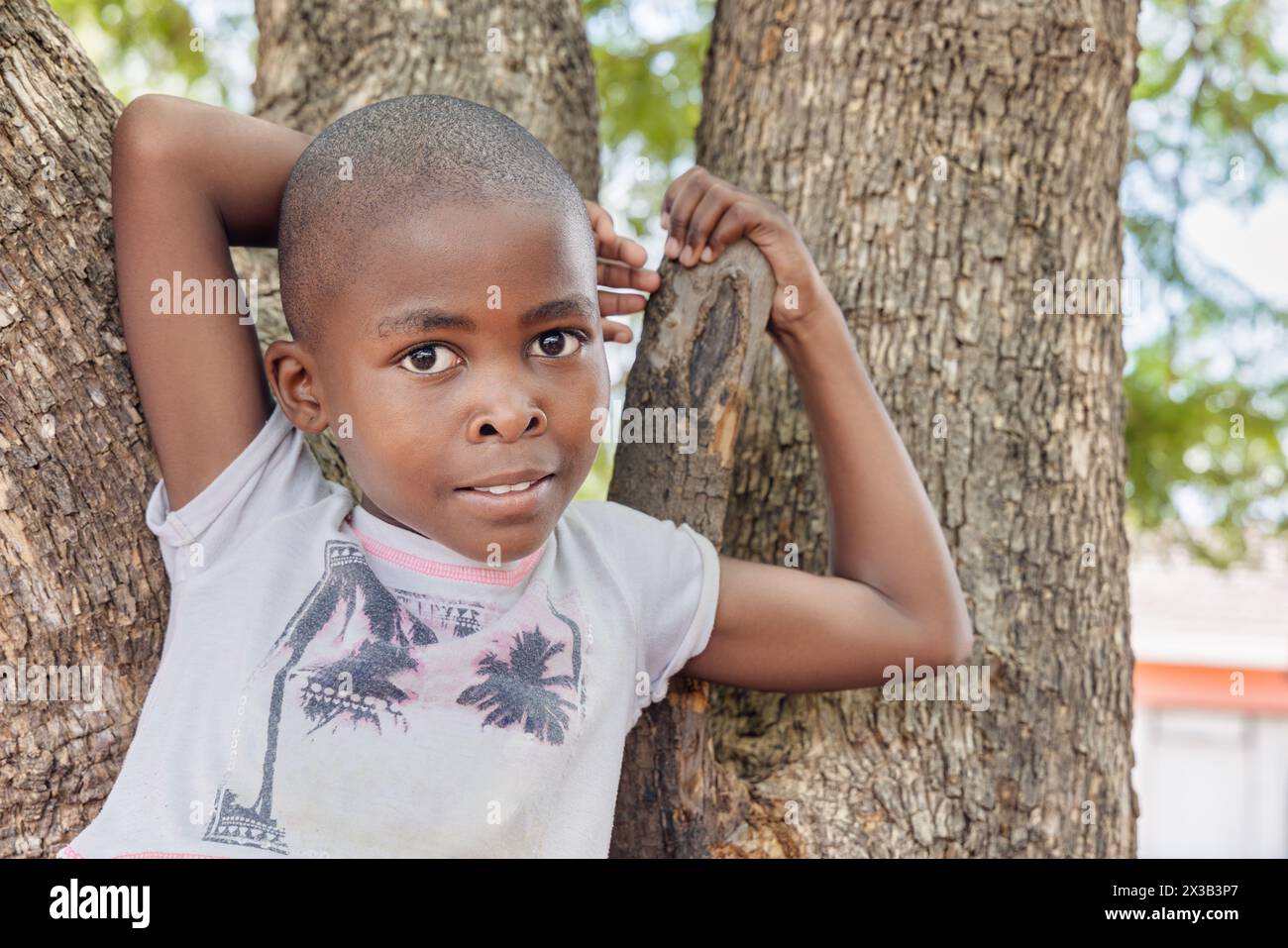 small village african girl, standing in in the yard , arms up in front ...