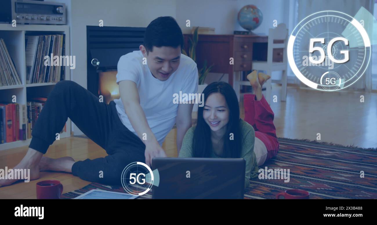 Image of multiple digital 5G icons over couple using laptop at home Stock Photo - Alamy