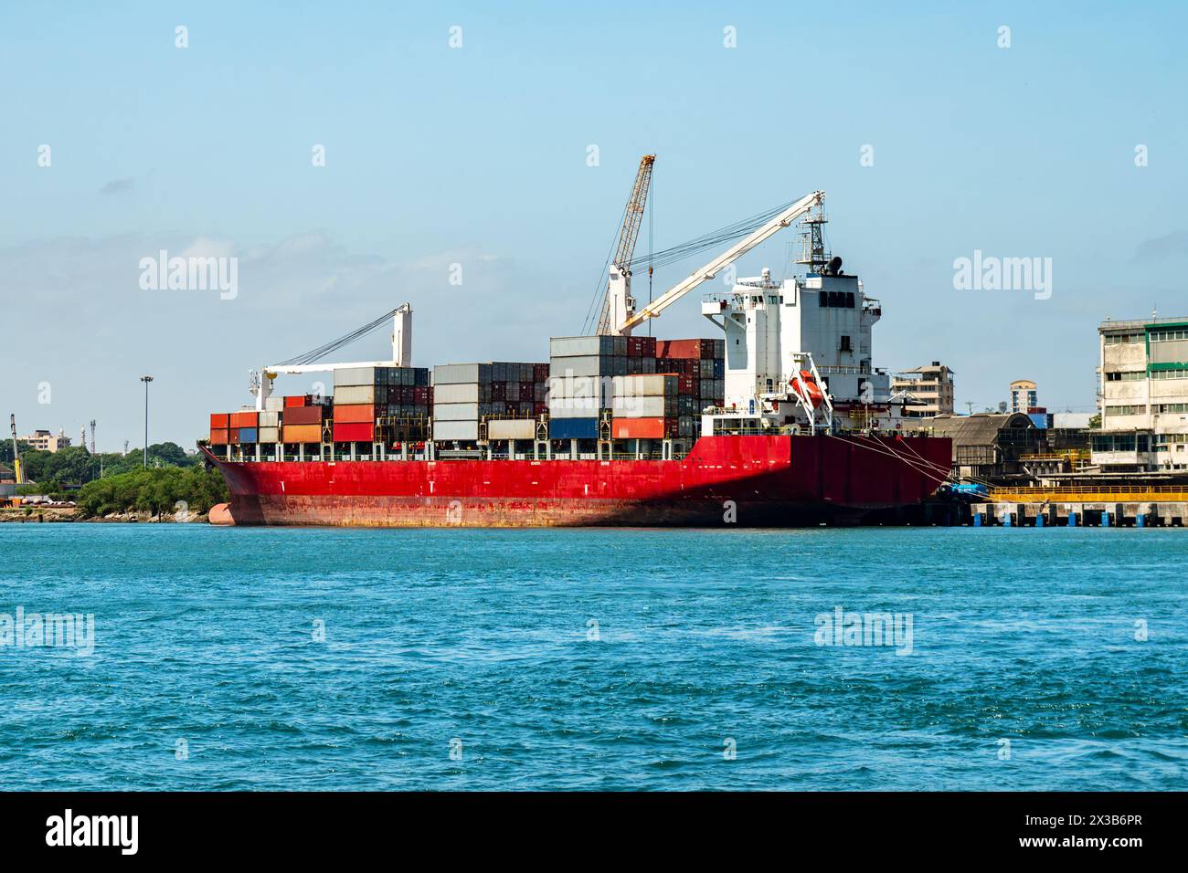 The container vessel during discharging at an industrial port and move ...