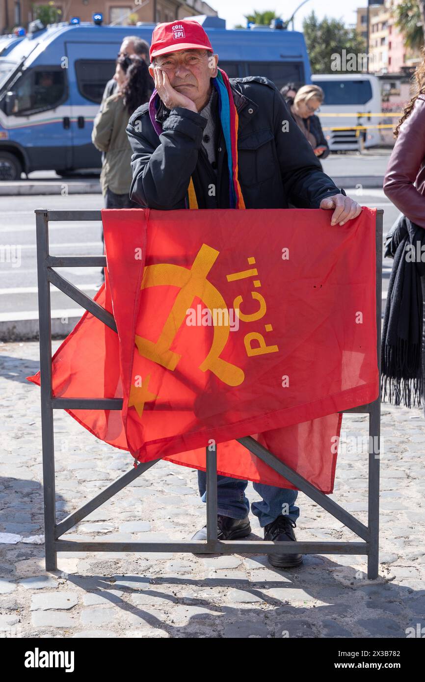 Rome, Italy. 25th Apr, 2024. A man with a red flag of the Italian ...