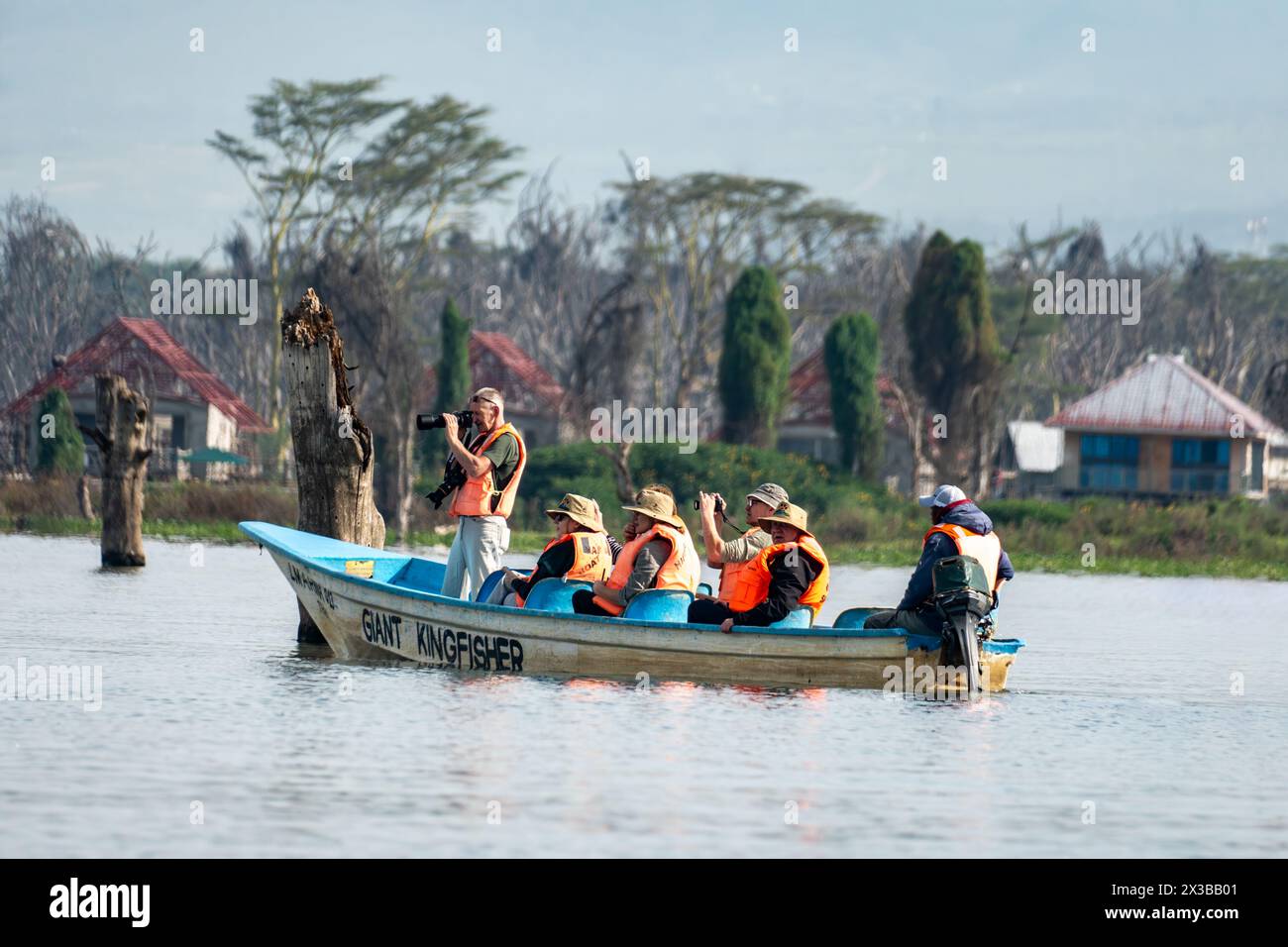 tourists sail by boat on Lake Naivasha. Water safari with viewing of ...